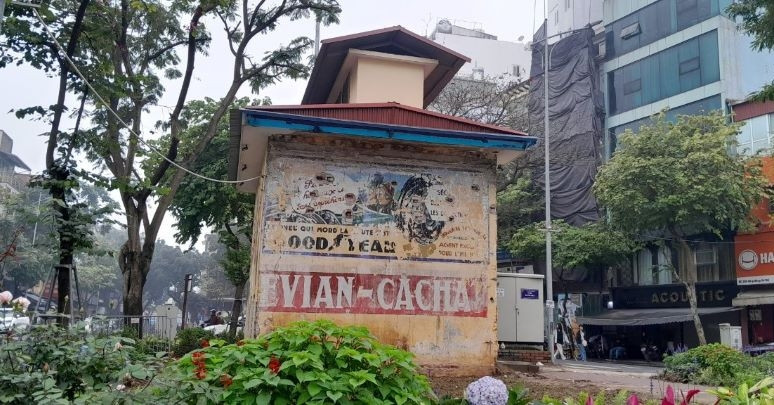 Colonial-era French ad posters preserved on Hanoi street
