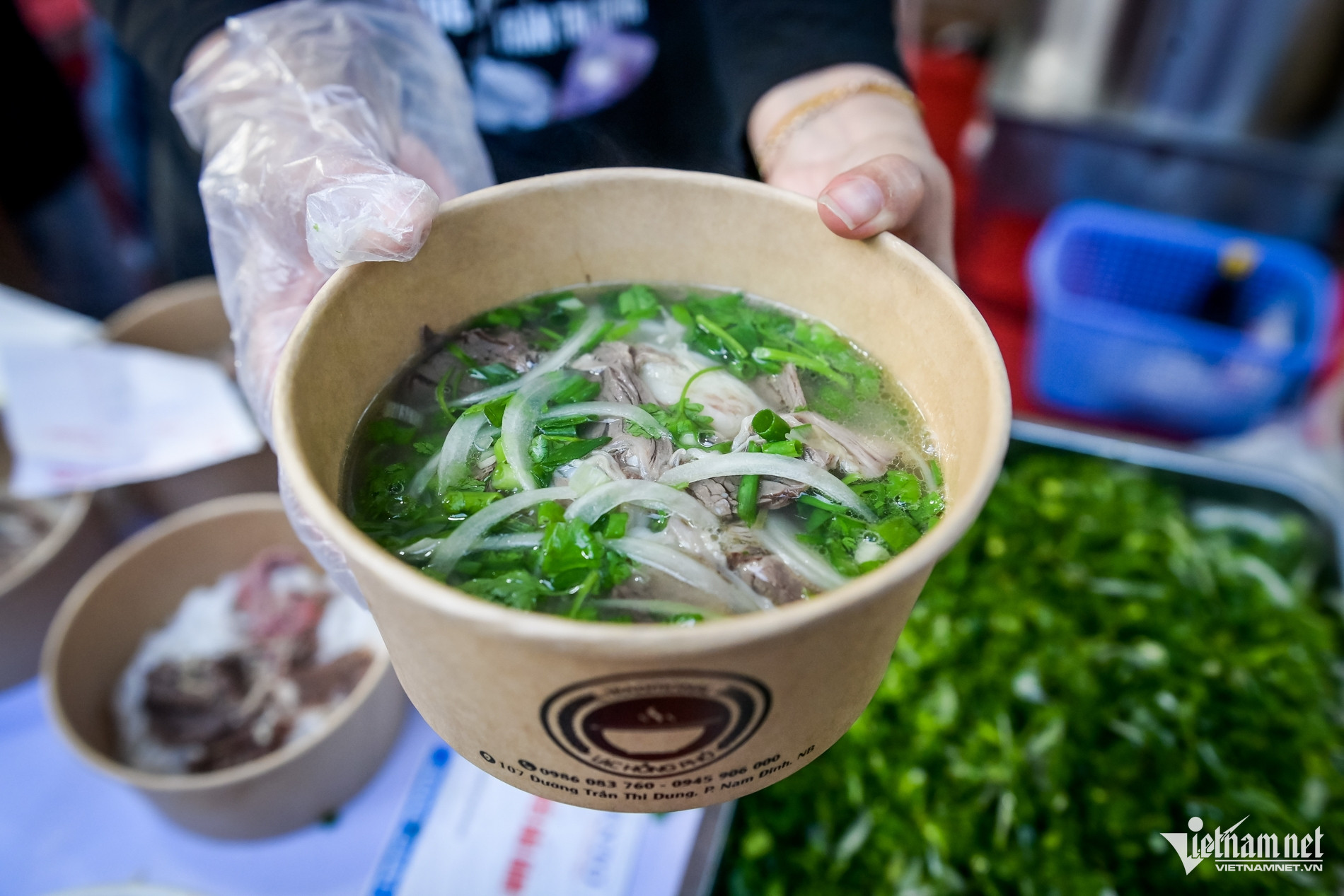 Thousands of people crowded together to enjoy the food at the Noodle ...