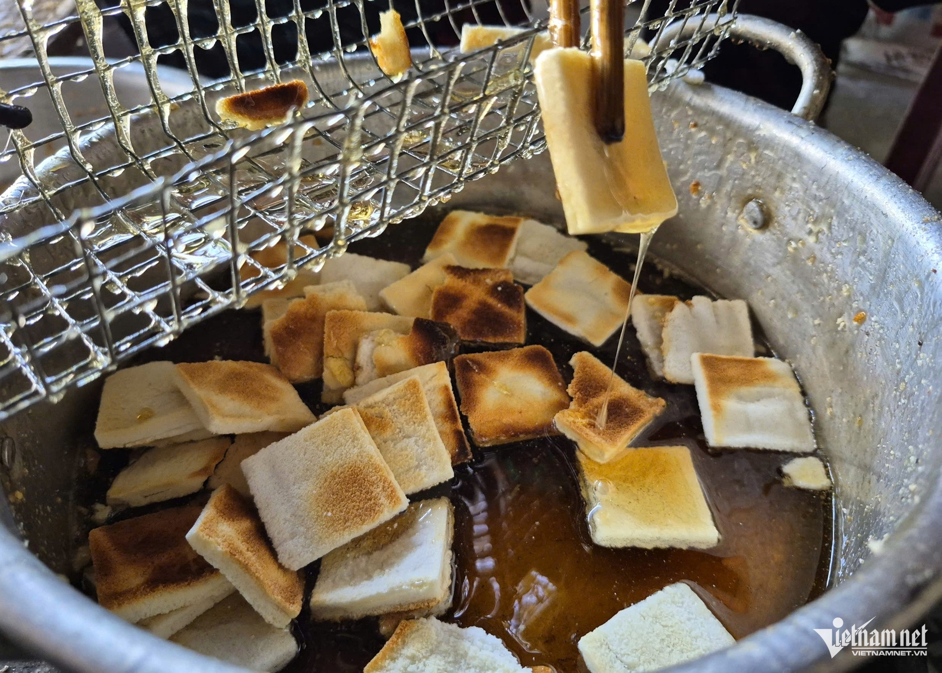 With fires blazing in the dead of night, the traditional pastry-making ...